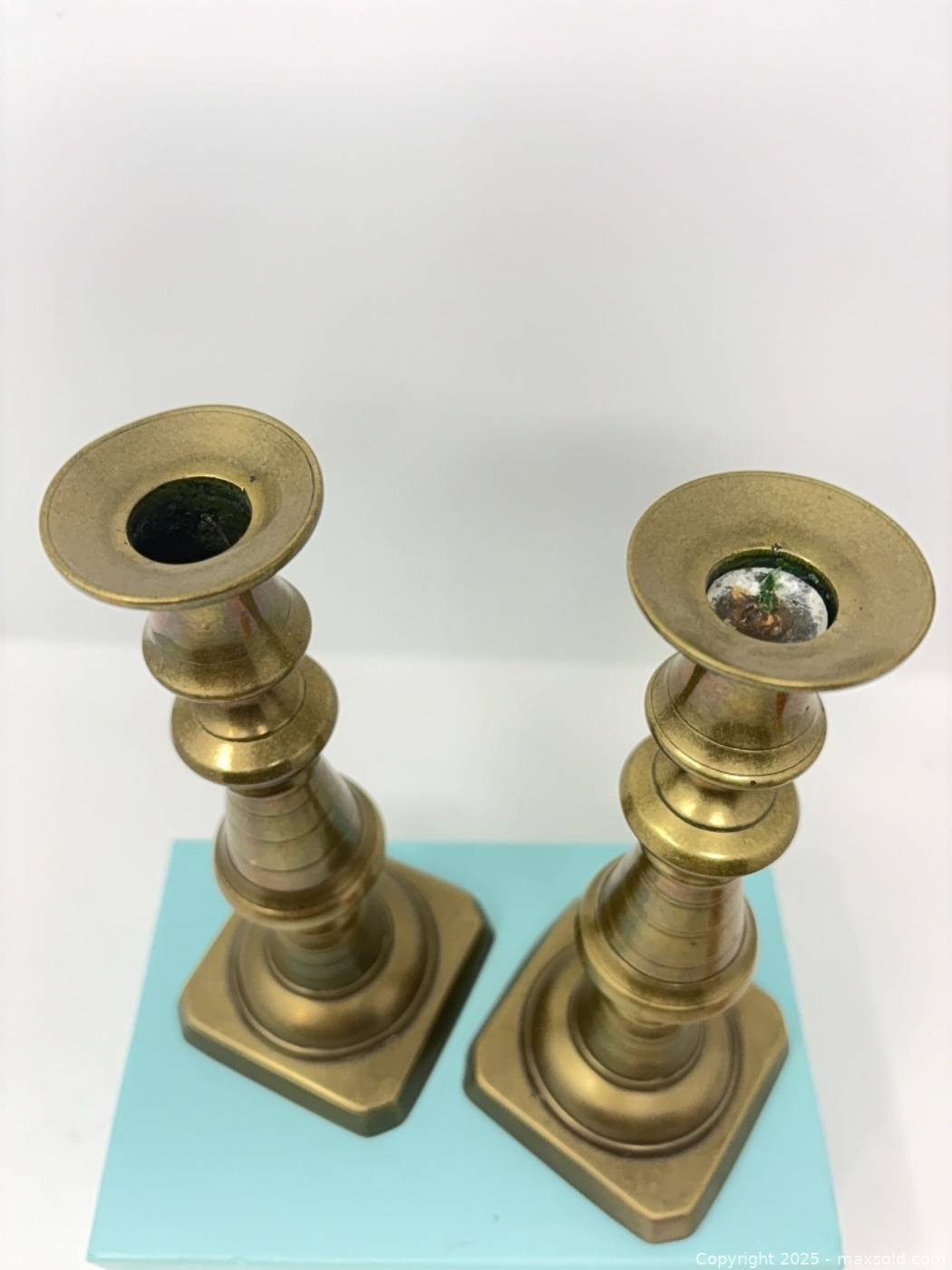 Pair brass push-up candlestick holders | Maxsold