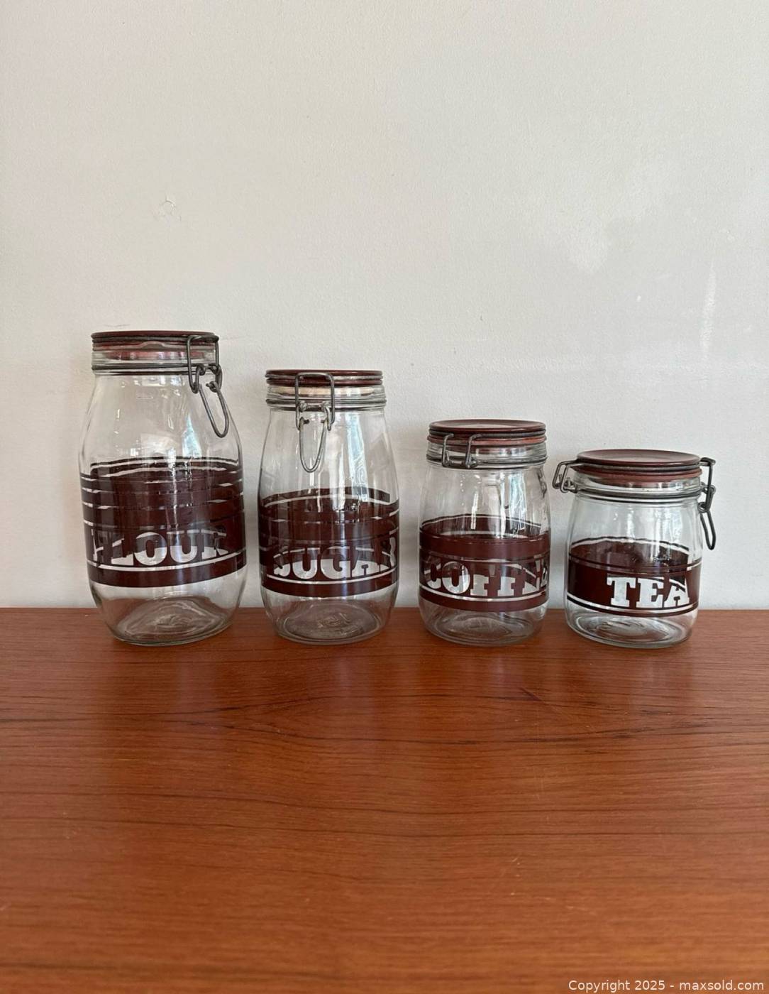 Four vintage glass canisters | Maxsold