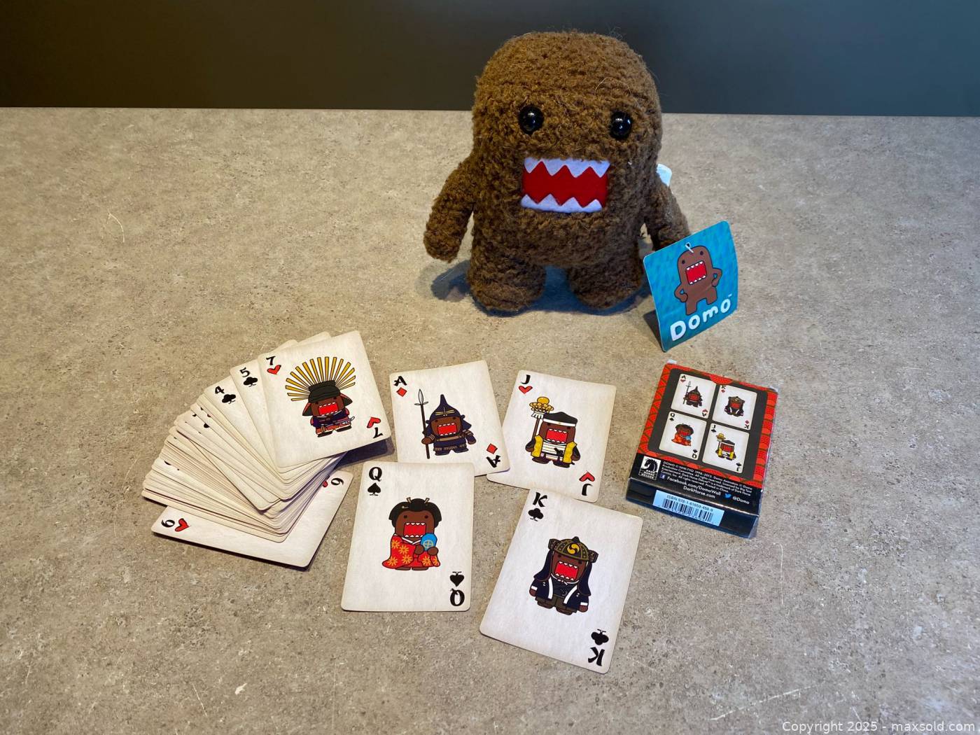 Domo plush with tagged deck of playing cards | Maxsold