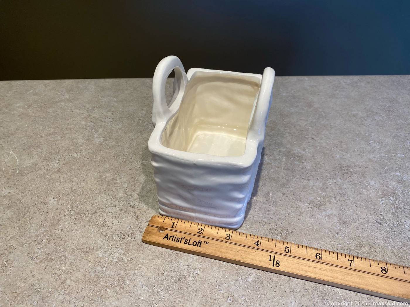 White ceramic tote-bag planter with handles | Maxsold