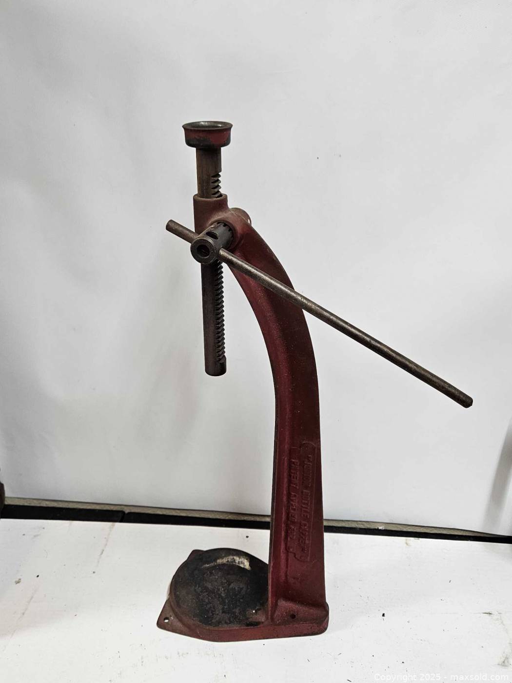 Cast iron bottle capper, pans & crate | Maxsold