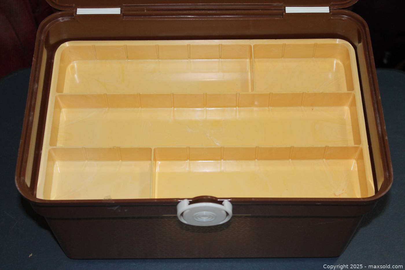 Brown plastic sewing box with thread spools | Maxsold