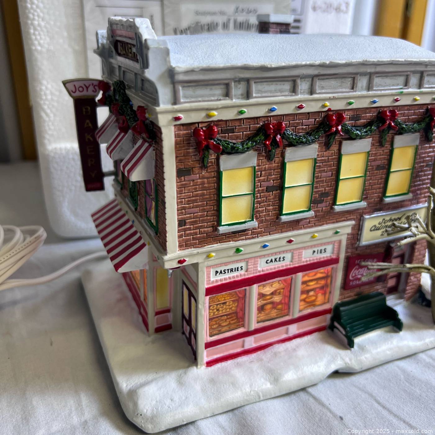 Coca-Cola Joy’s Bakery lighted building | Maxsold