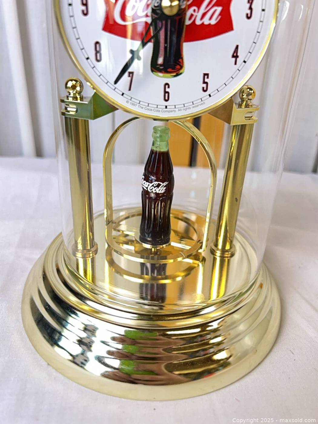 Vintage Coca-Cola rotating anniversary clock | Maxsold
