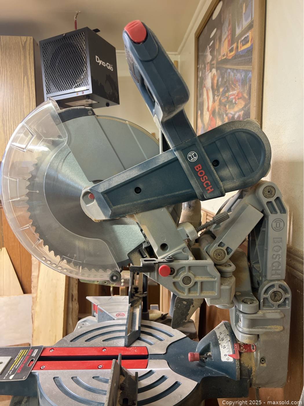 Bosch 12" dual-bevel glide compound miter saw on stand | Maxsold