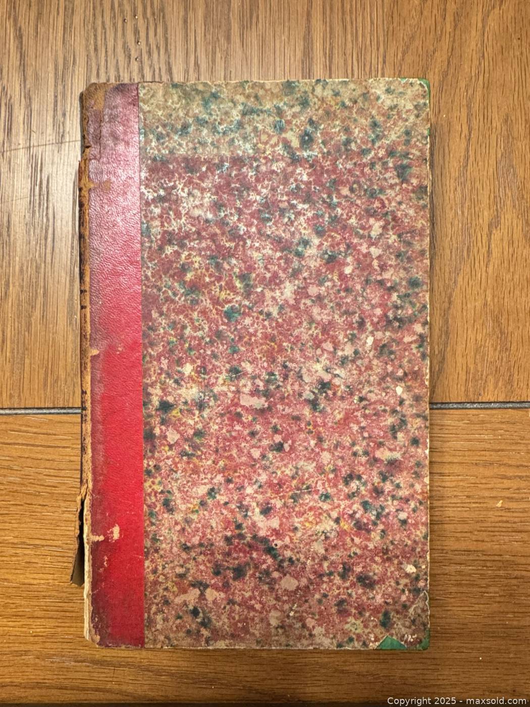 Antique hardcover book with marbled boards | Maxsold