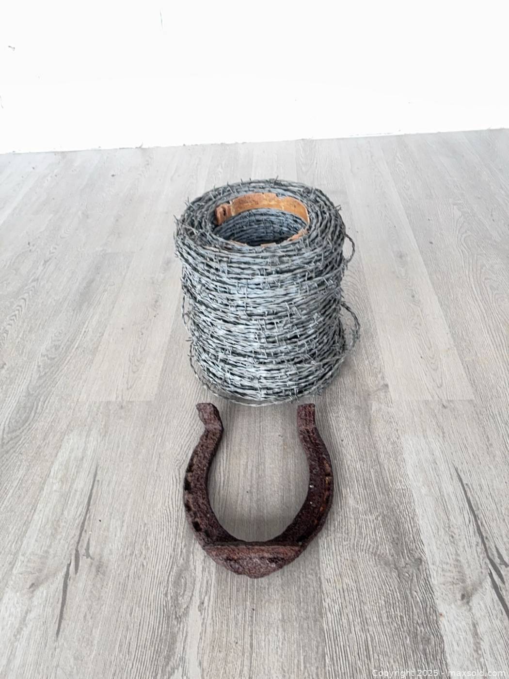 Barbed wire roll and horseshoe | Maxsold