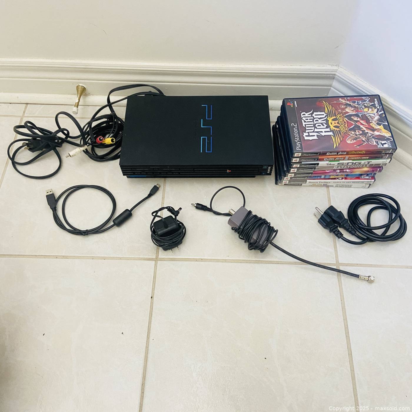 Sony PlayStation 2 console & 8 games | Maxsold