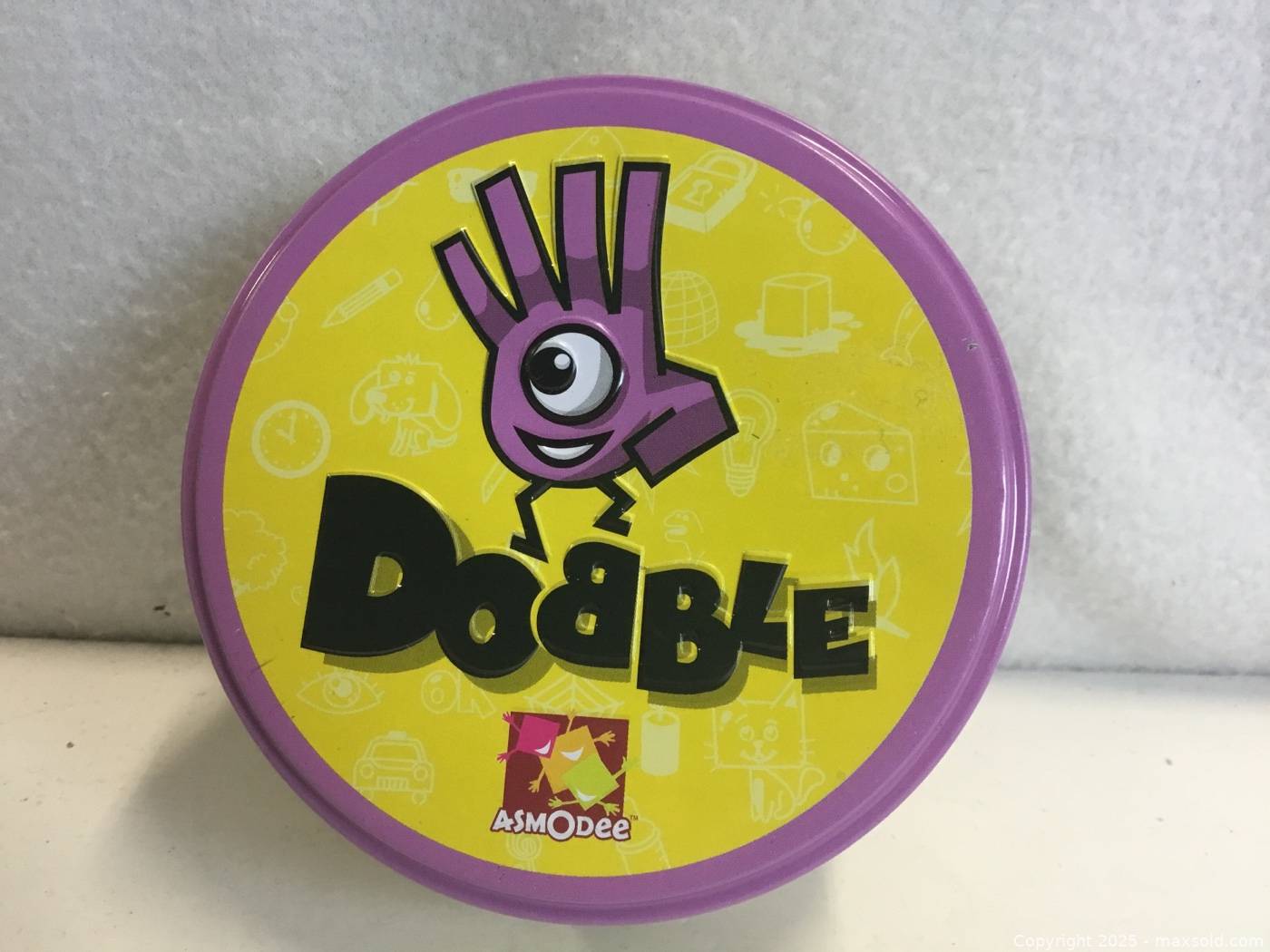Dobble card game in tin | Maxsold