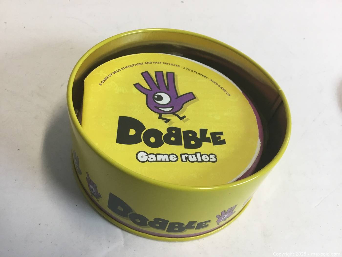 Dobble card game in tin | Maxsold