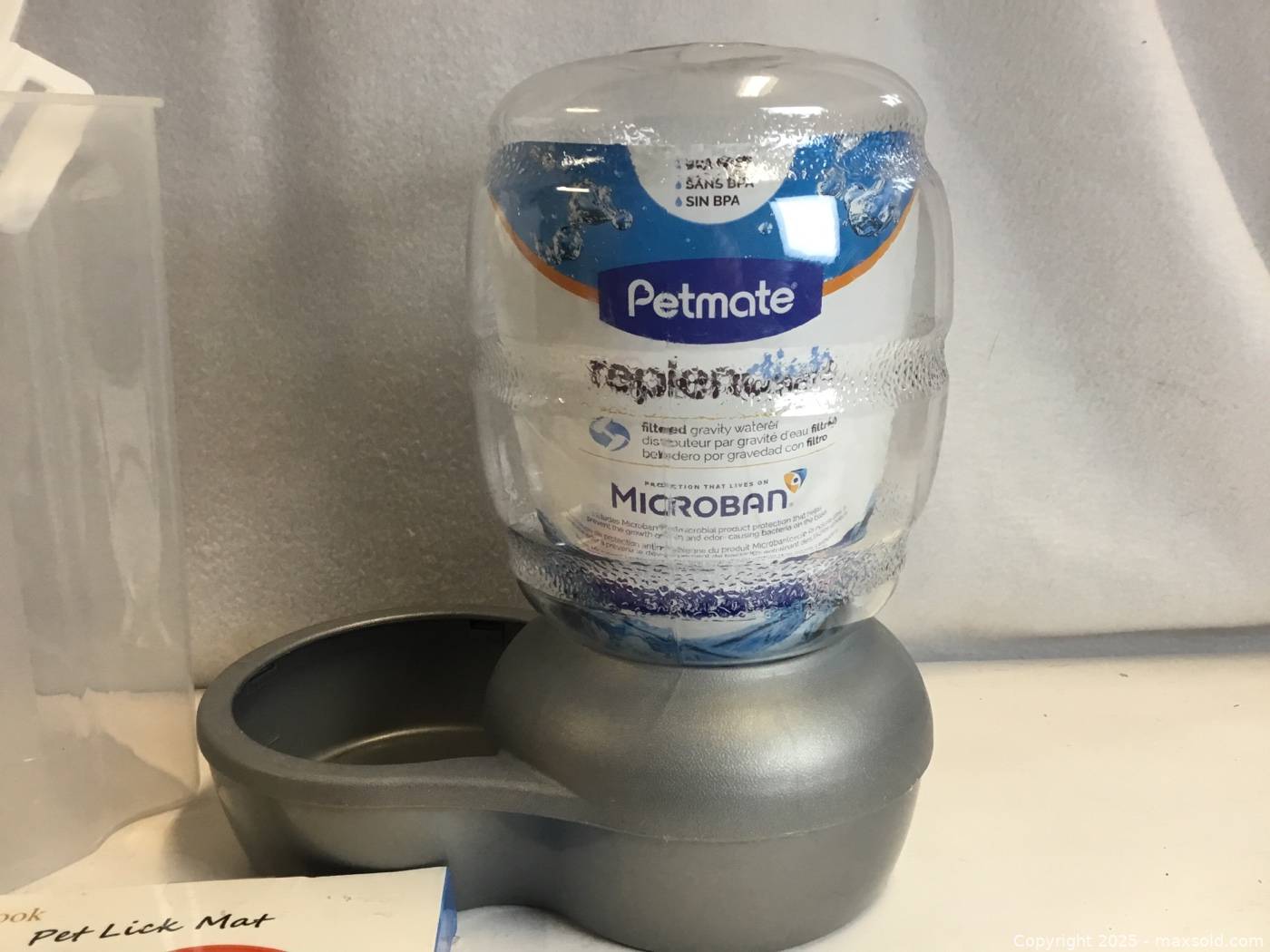 Petmate gravity waterer, food container and lick mats | Maxsold
