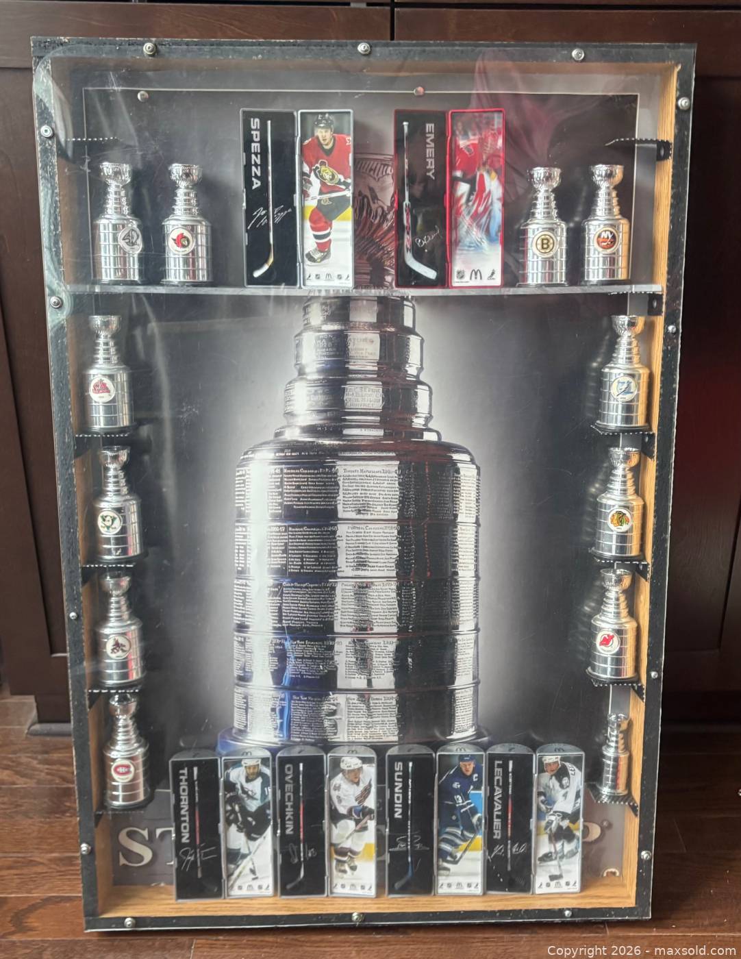Display case with 12 Labatt mini Stanley Cups, 6 McDonald's NHL lockers ...