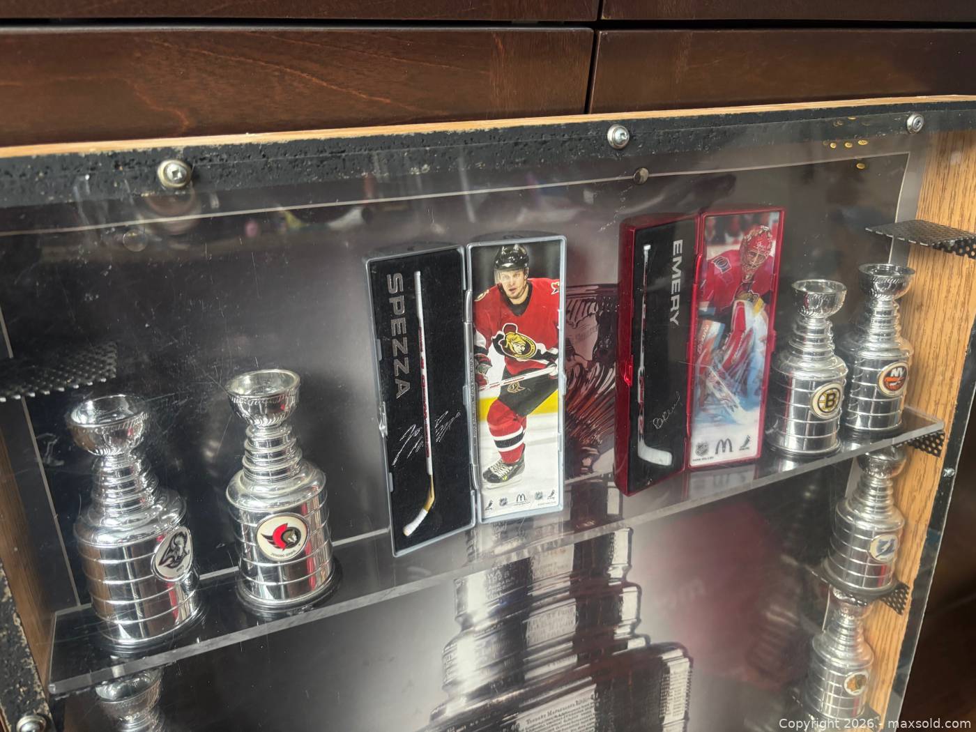 Display case with 12 Labatt mini Stanley Cups, 6 McDonald's NHL lockers ...