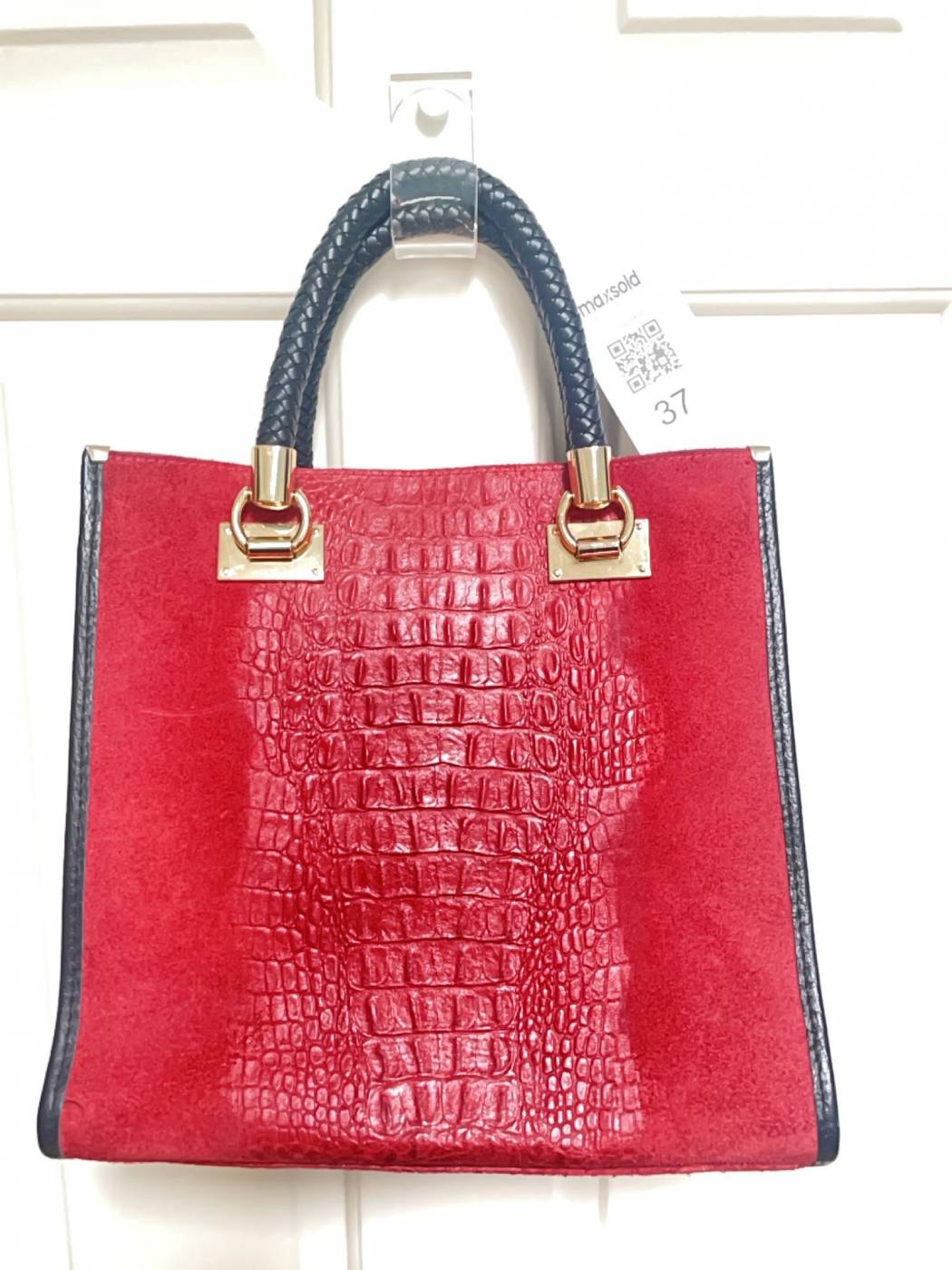 Red suede tote bag with black braided handles | Maxsold