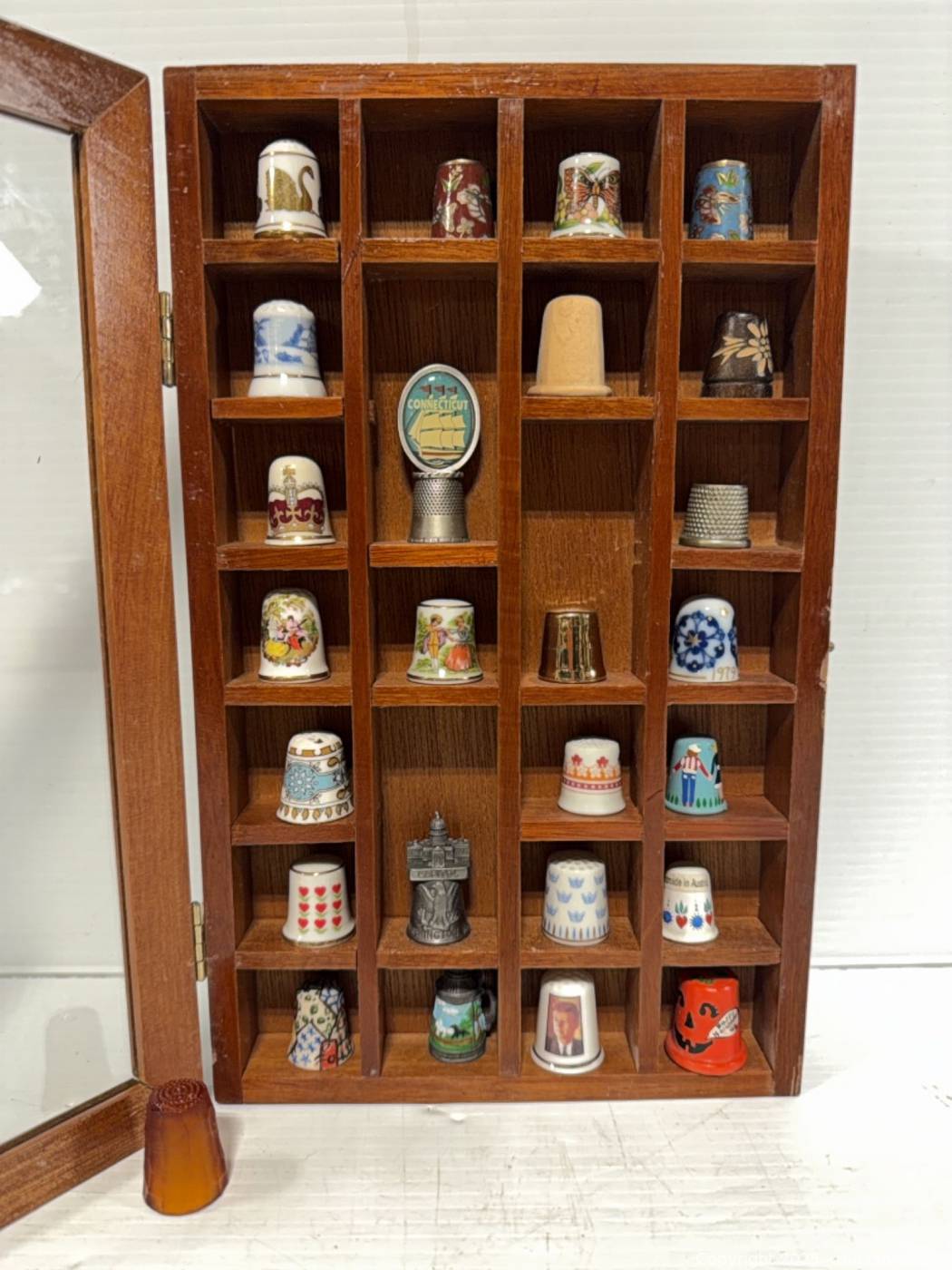 26 collectible thimbles with display case | Maxsold