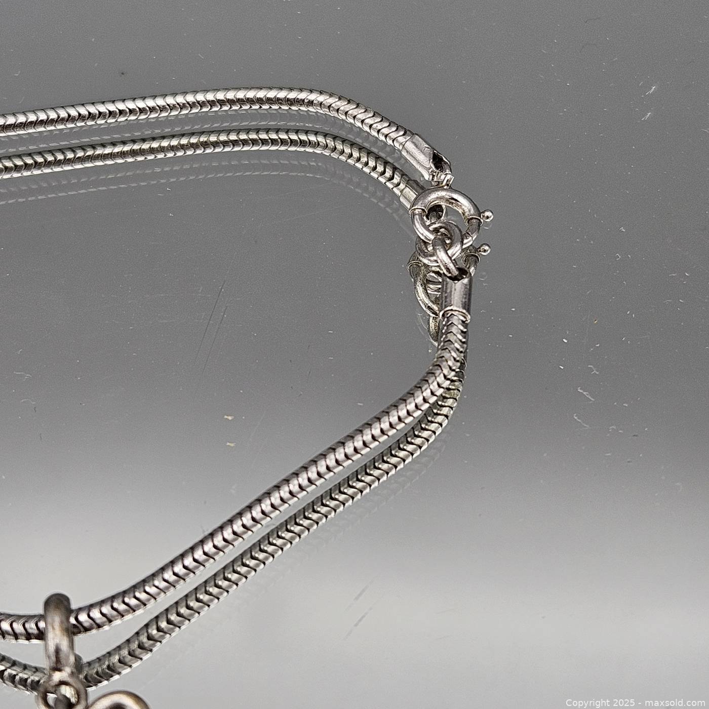 Silver-plated two-strand snake chain charm bracelet | Maxsold