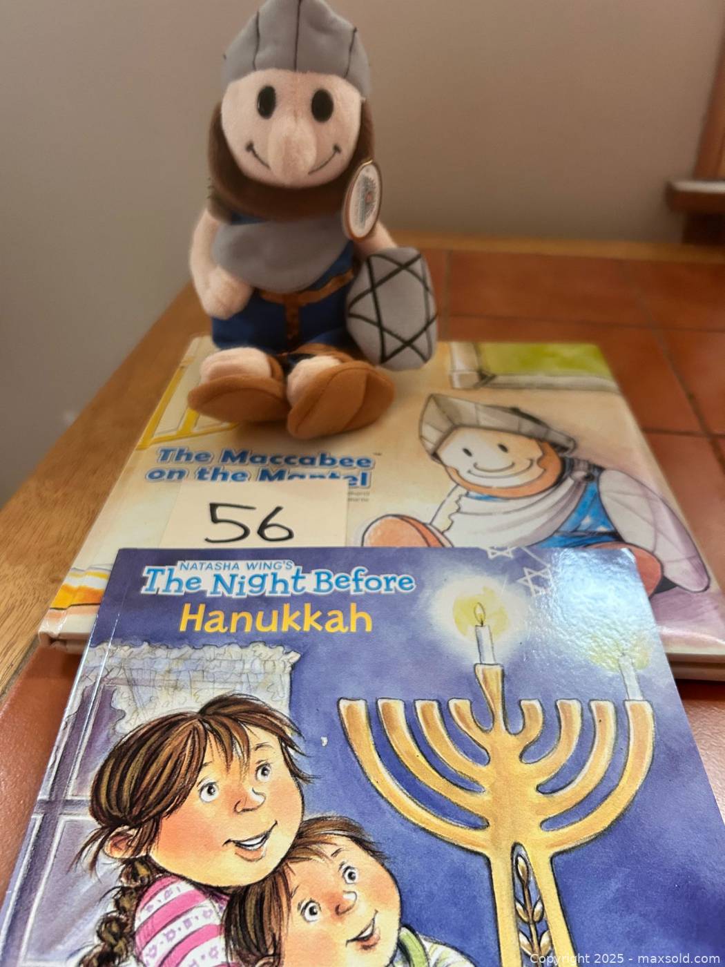 The Maccabee on the Mantel plush with two Hanukkah books | Maxsold