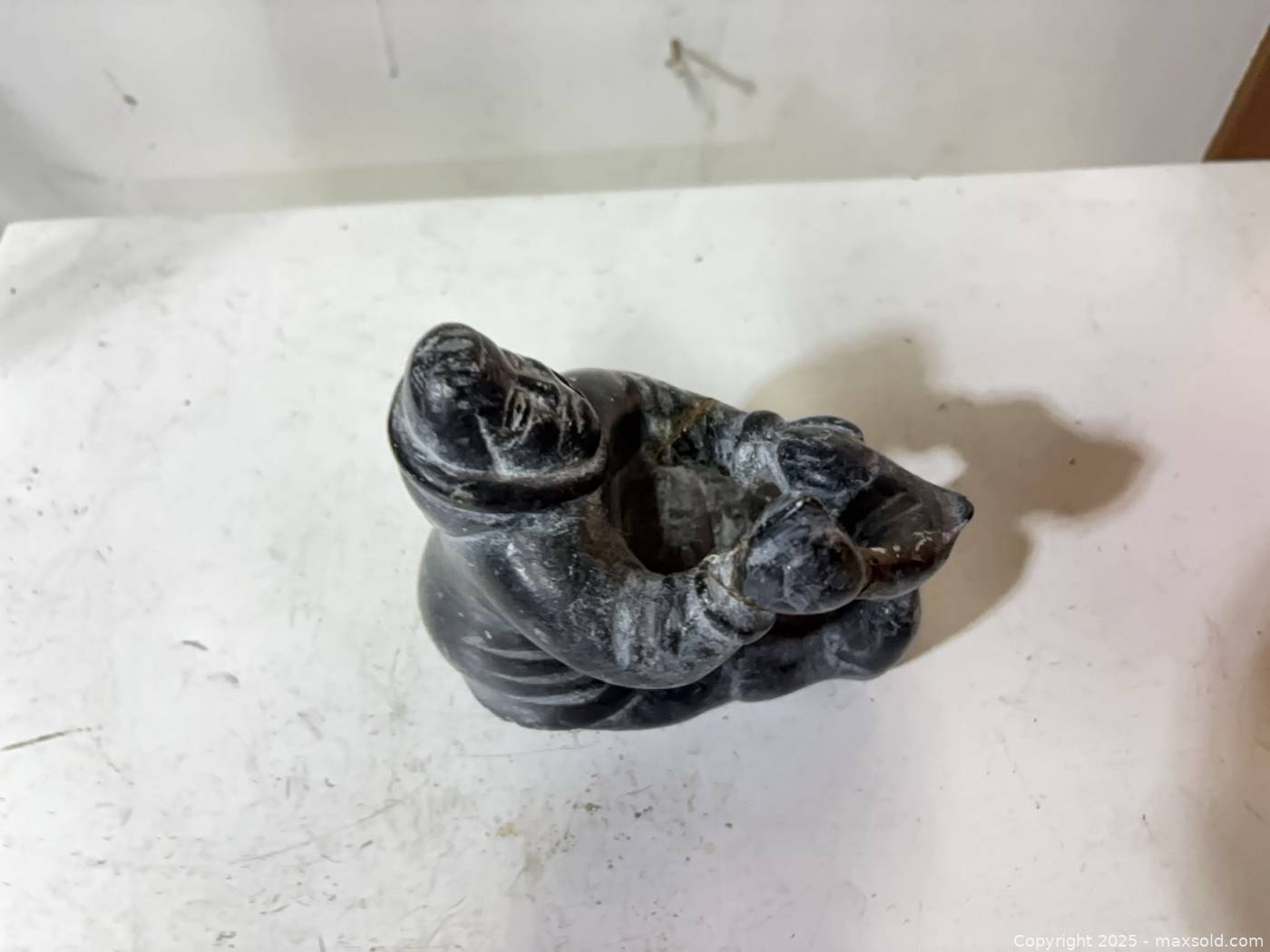 Inuit soapstone carving seated figure 4 in | Maxsold