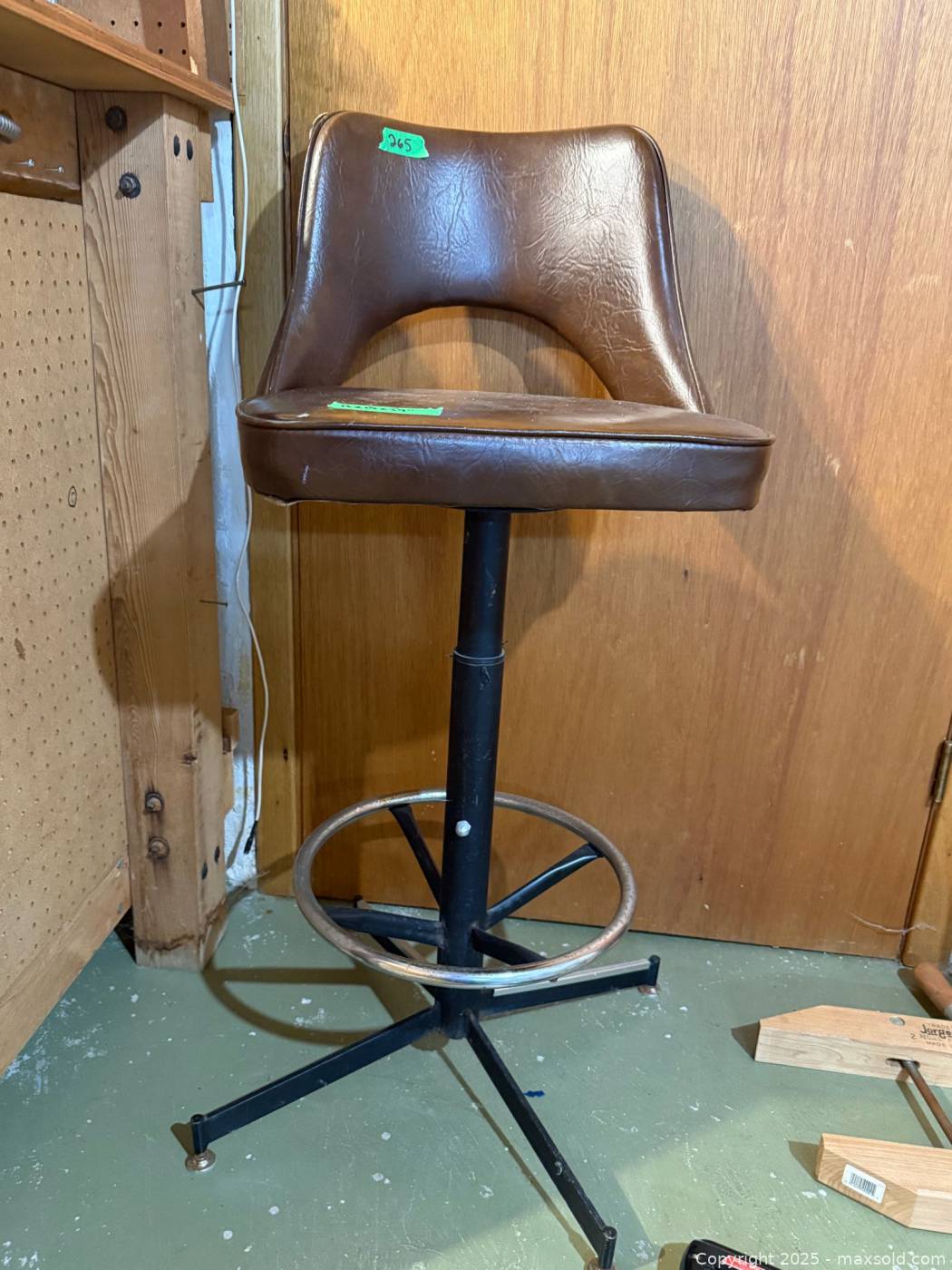Swivel bar stool with assorted hand tools | Maxsold