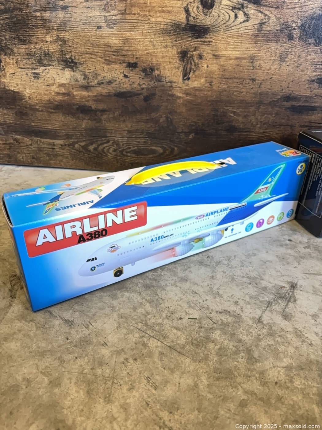 Toy helicopter and airplane in sealed boxes | Maxsold