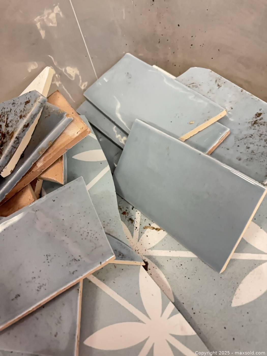 Broken ceramic tiles and storage tub | Maxsold
