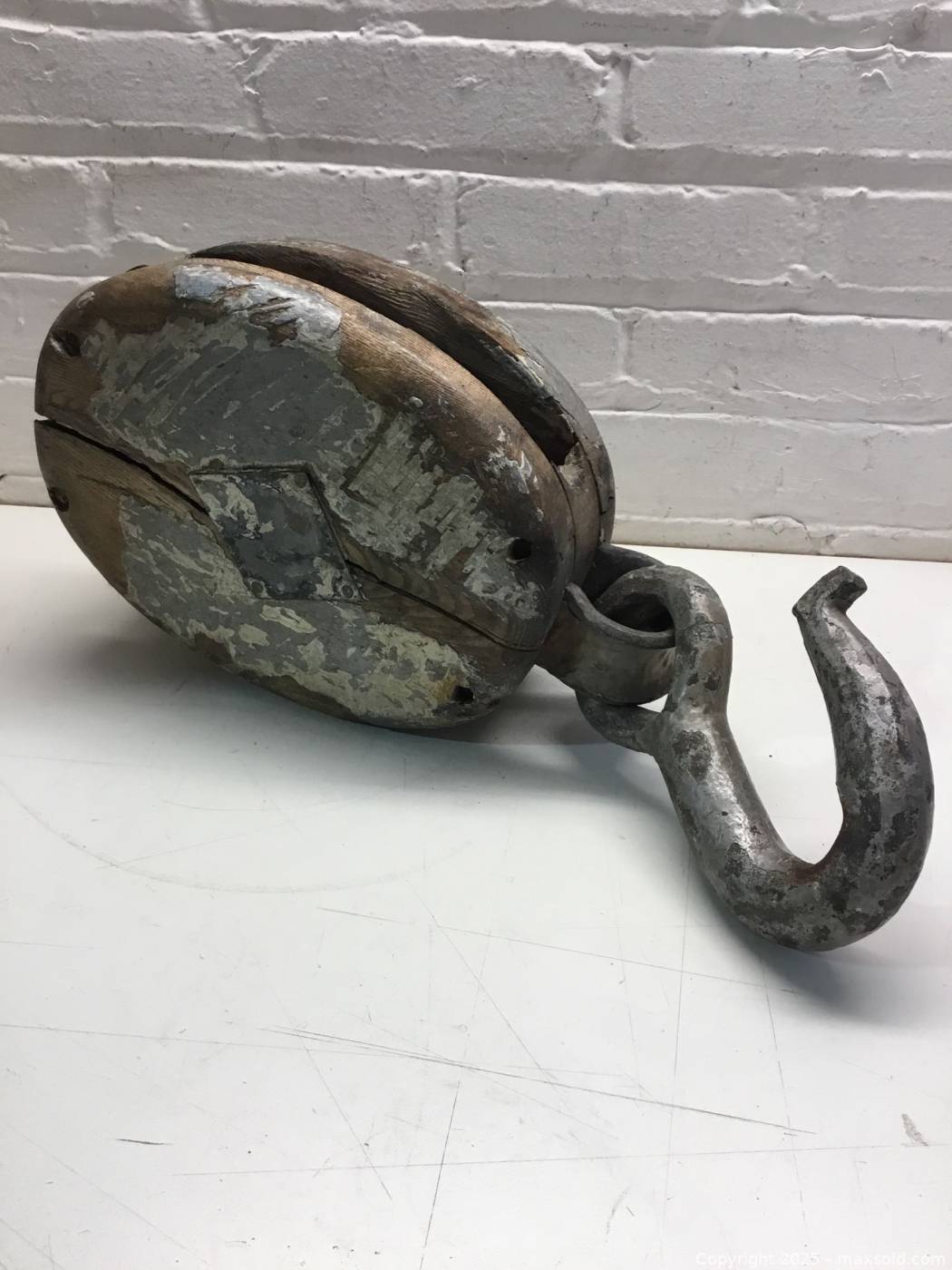 Large antique wooden pulley with iron hook | Maxsold