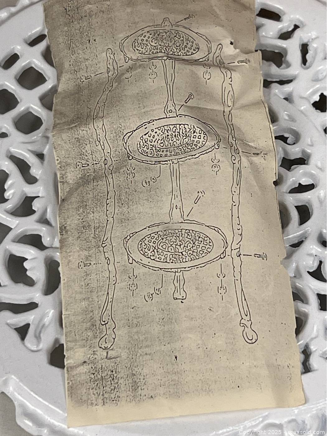 Unassembled three-tier metal plant stand | Maxsold