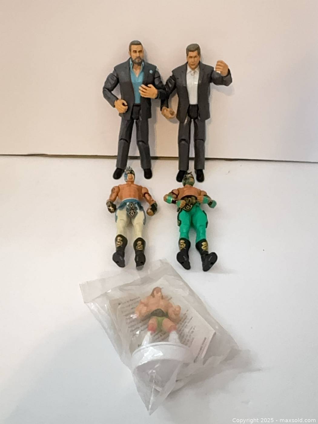 Mattel WWE Action Figures & Ultimate Warrior Stamp | Maxsold