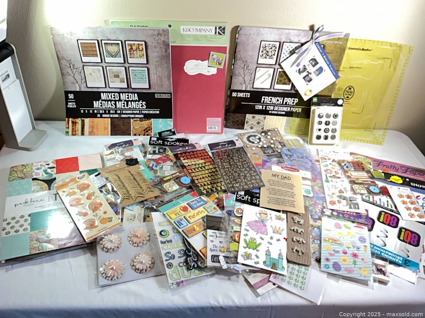 Scrapbooking paper pads and new sticker packs | Maxsold