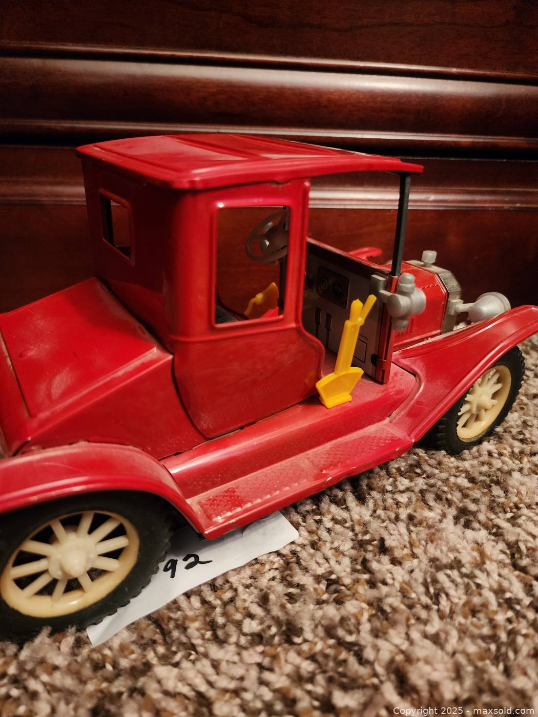 Red plastic vintage-style model car | Maxsold