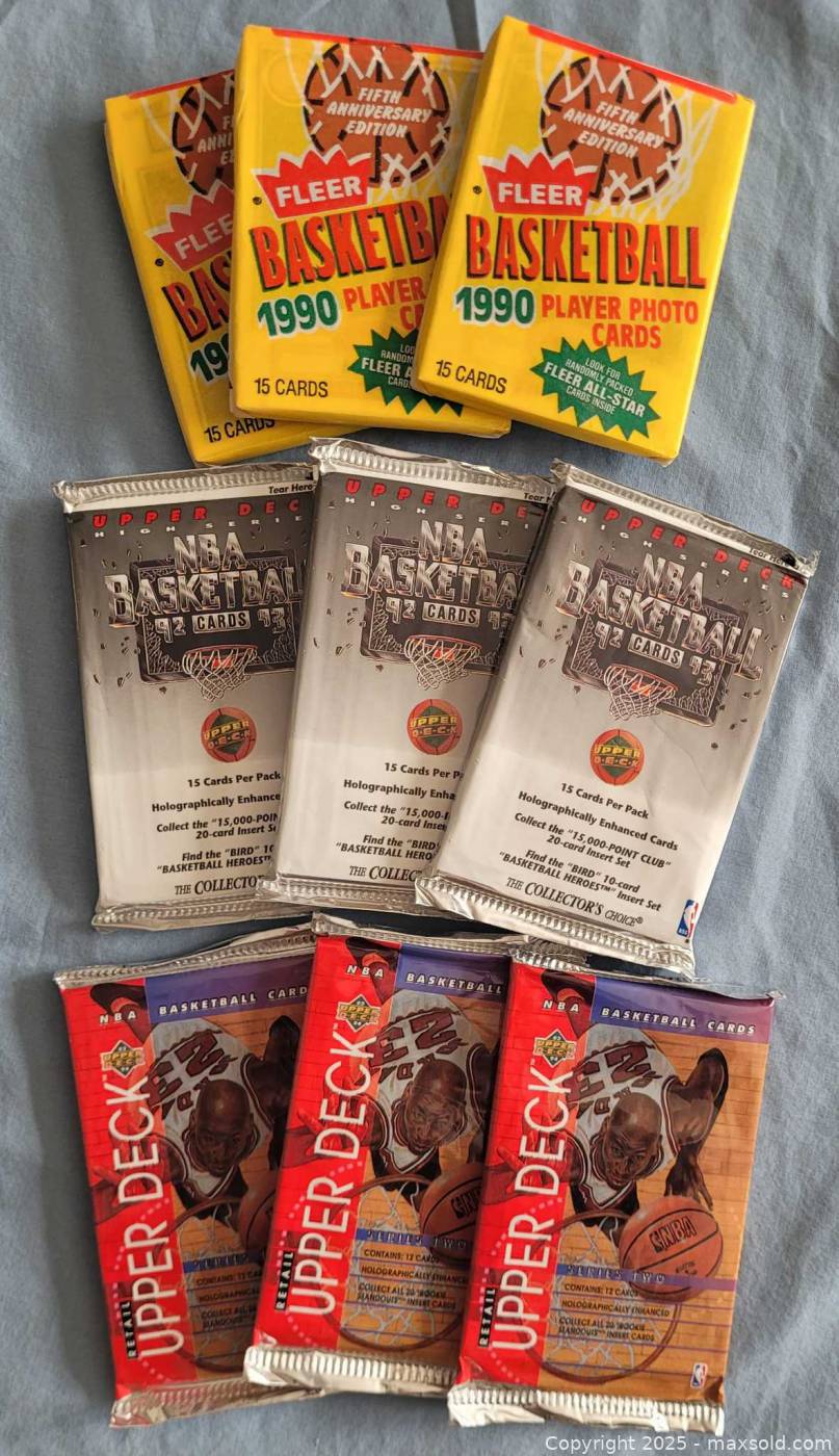 Nine unopened Fleer 1990 and Upper Deck 1992-93 basketball card packs ...