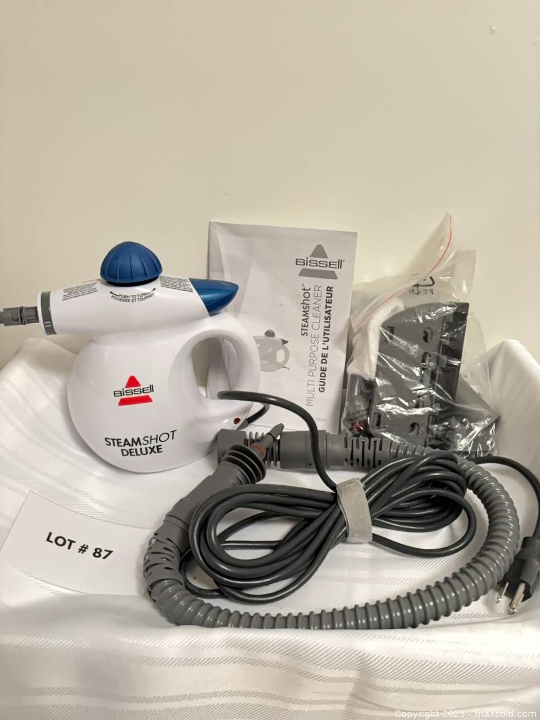 Bissell SteamShot Deluxe handheld steamer with accessories | Maxsold