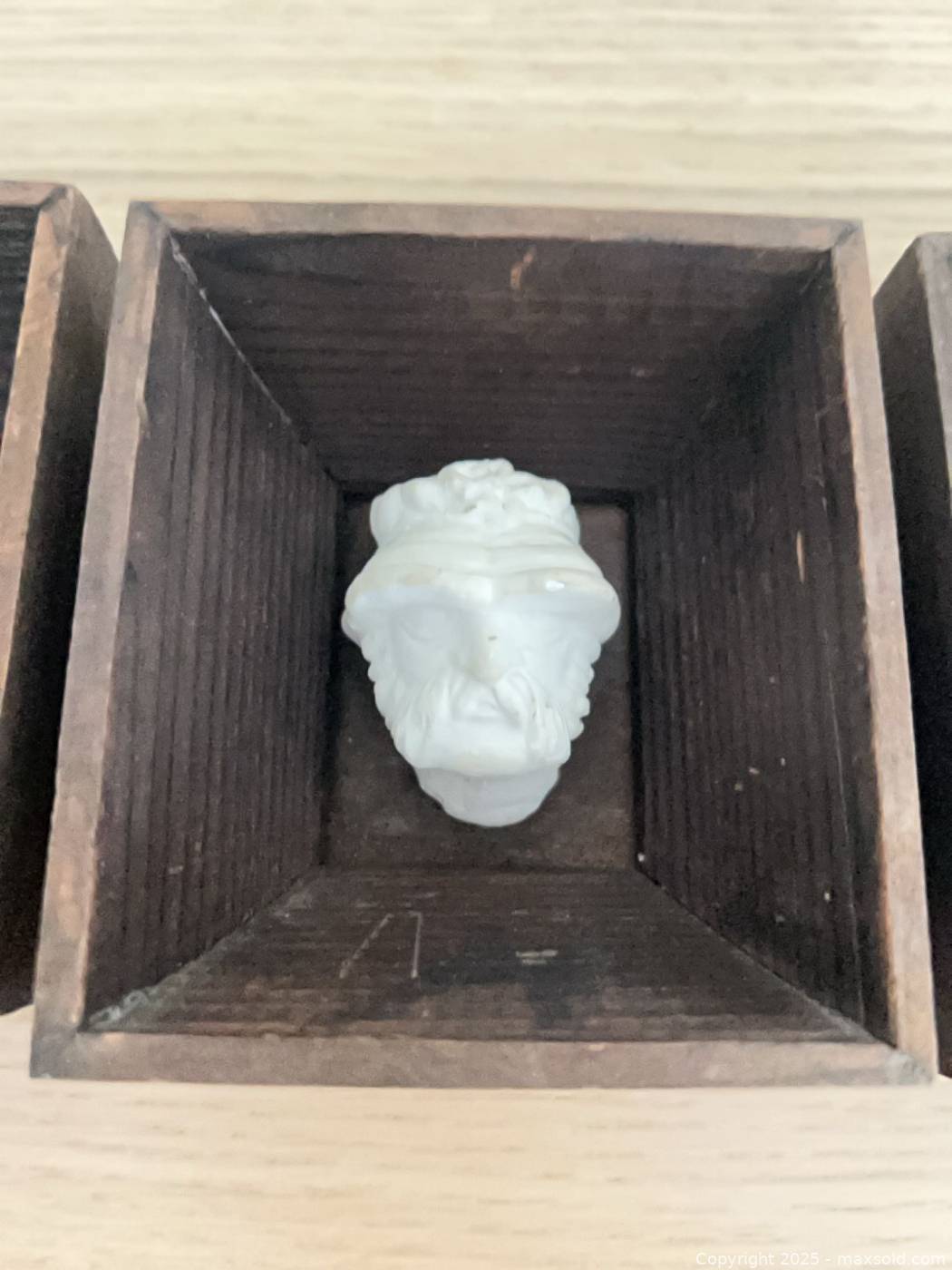 Polish cast plaster heads in wood frames | Maxsold