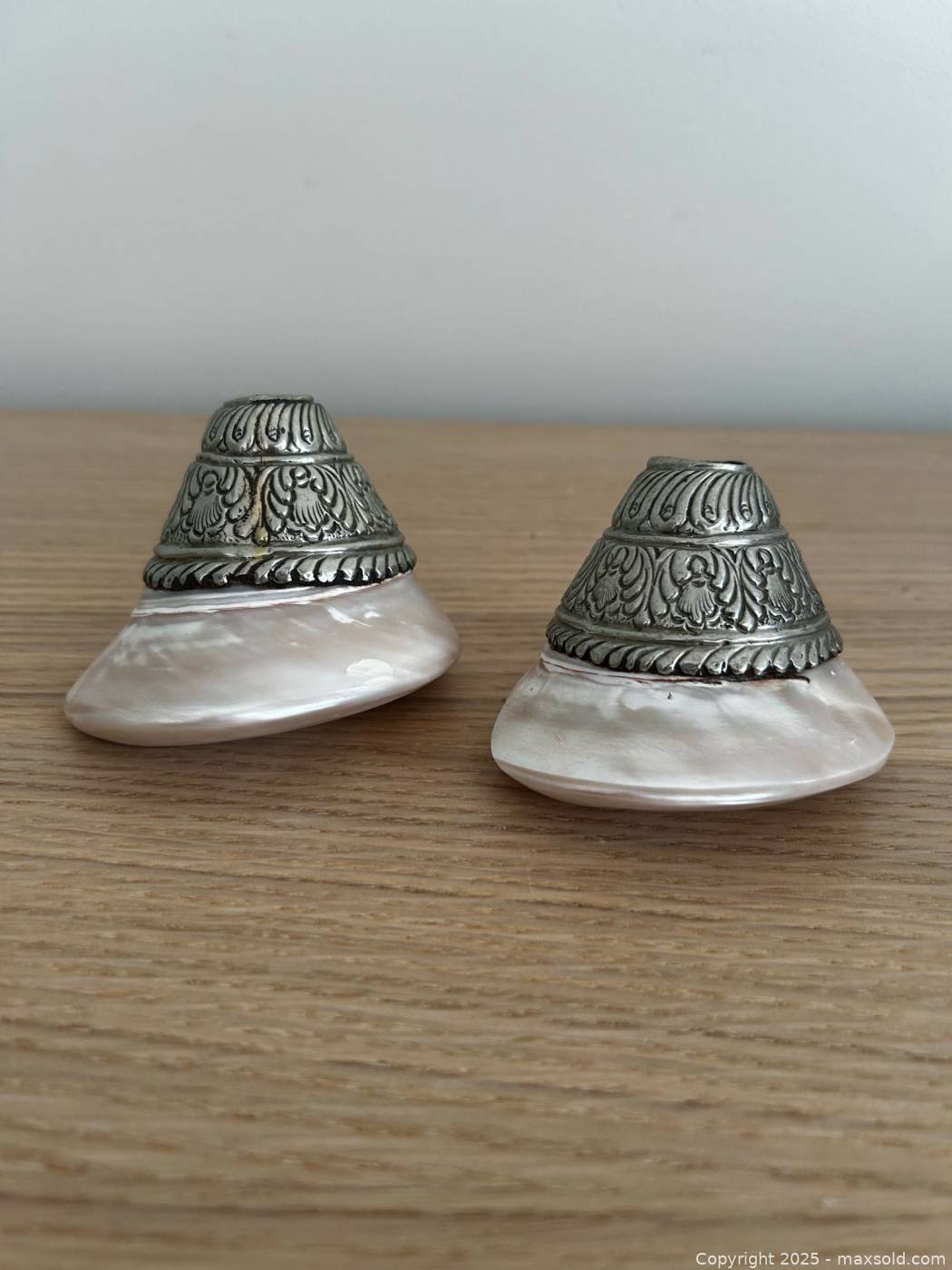 Pair shell curios with ornate metal caps | Maxsold