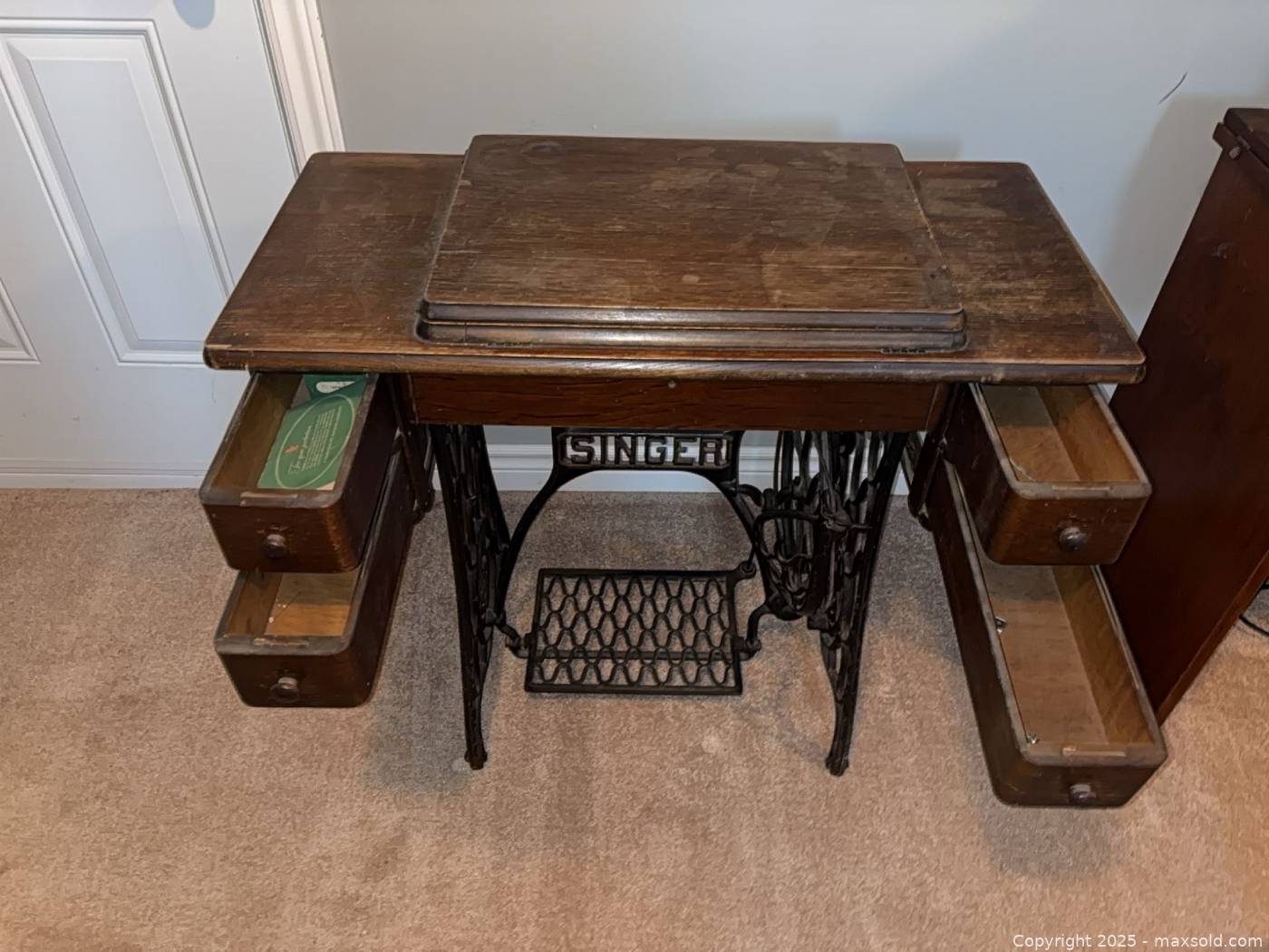 Singer treadle sewing machine cabinet | Maxsold