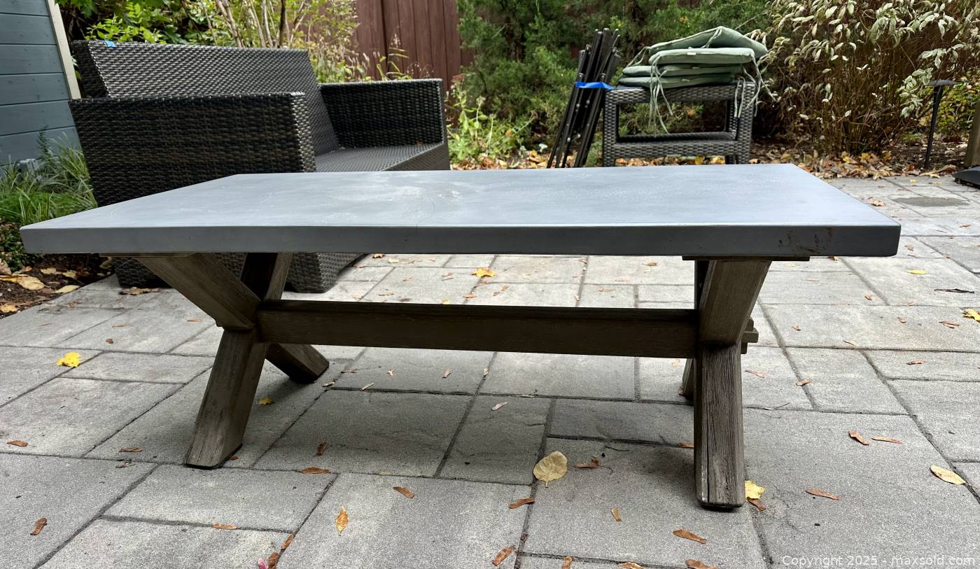 Pottery Barn Abbott outdoor coffee table and oval hardwood dining table | Maxsold