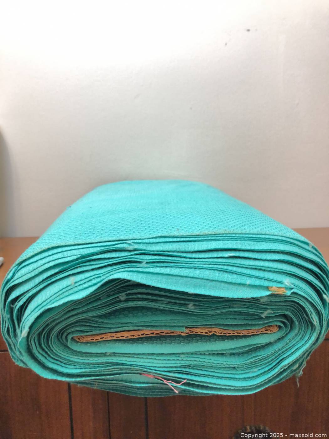 Bolt of turquoise waffle-weave fabric | Maxsold