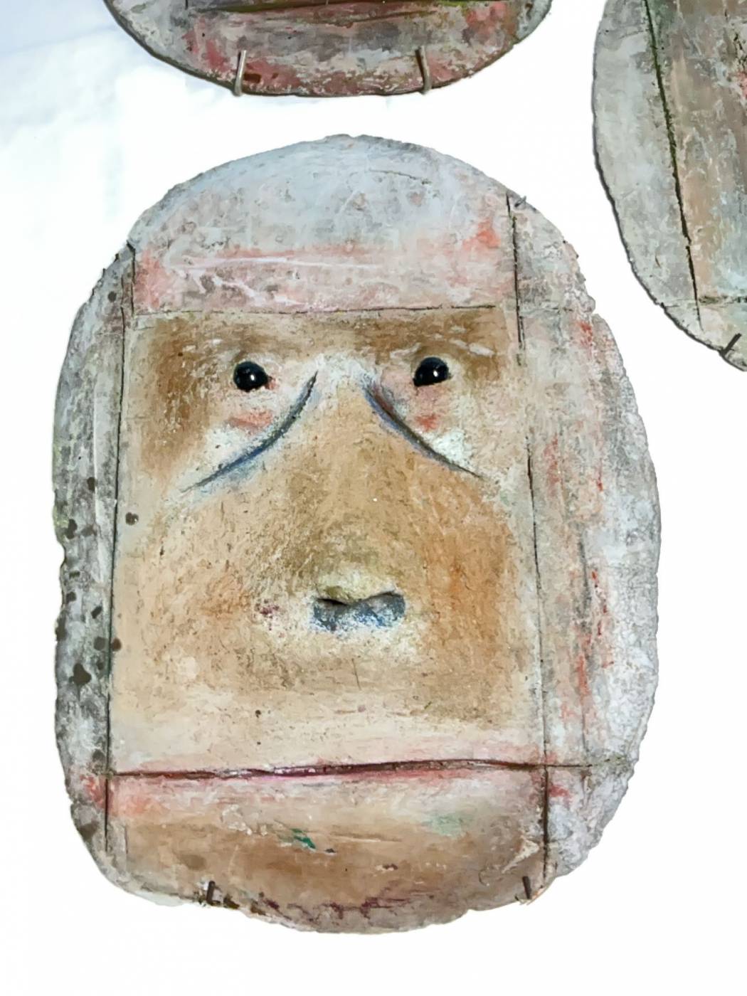 Set of four cement face wall plaques | Maxsold