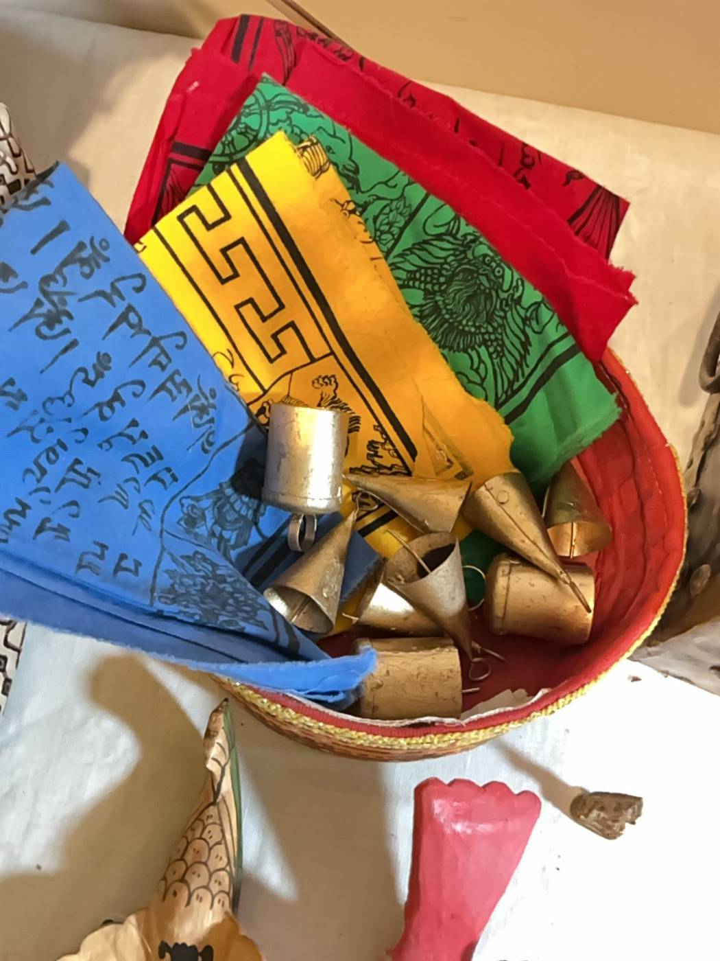 Prayer flags, painted chest, puppet, cushion | Maxsold
