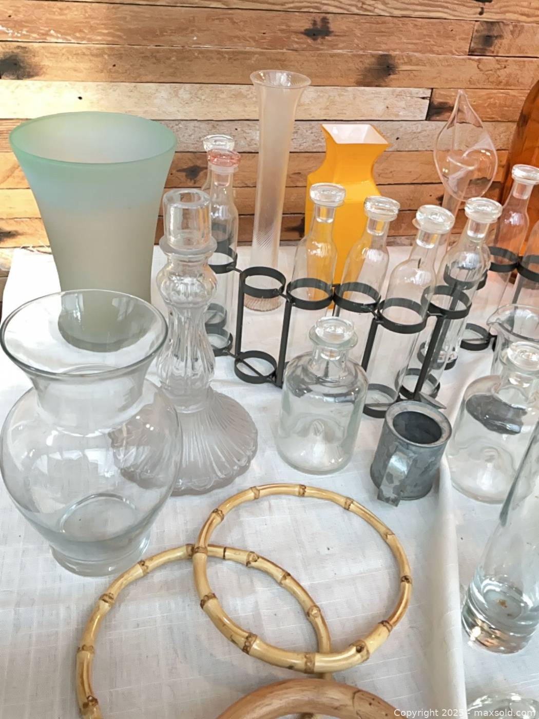 Glass vases, bottles and flower frogs | Maxsold