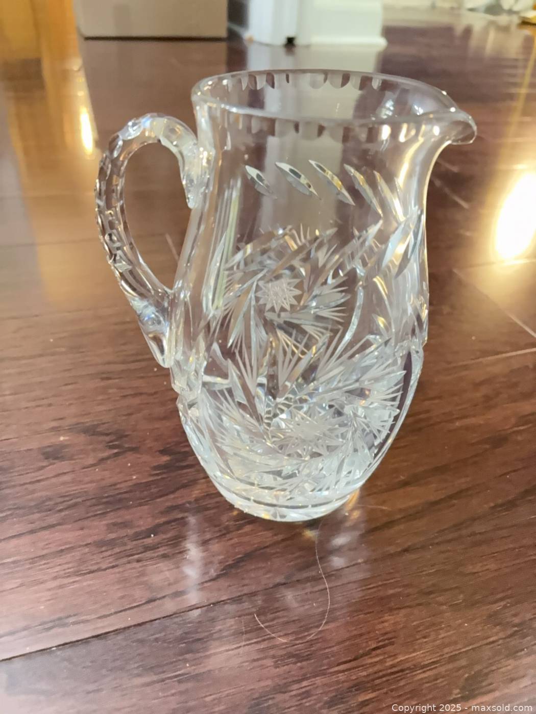 Two pinwheel cut crystal vases and pitcher | Maxsold