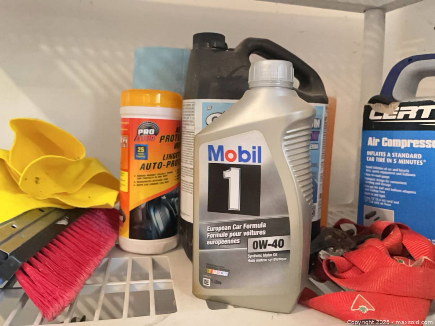 Resin utility shelf with automotive, gardening and maintenance supplies ...