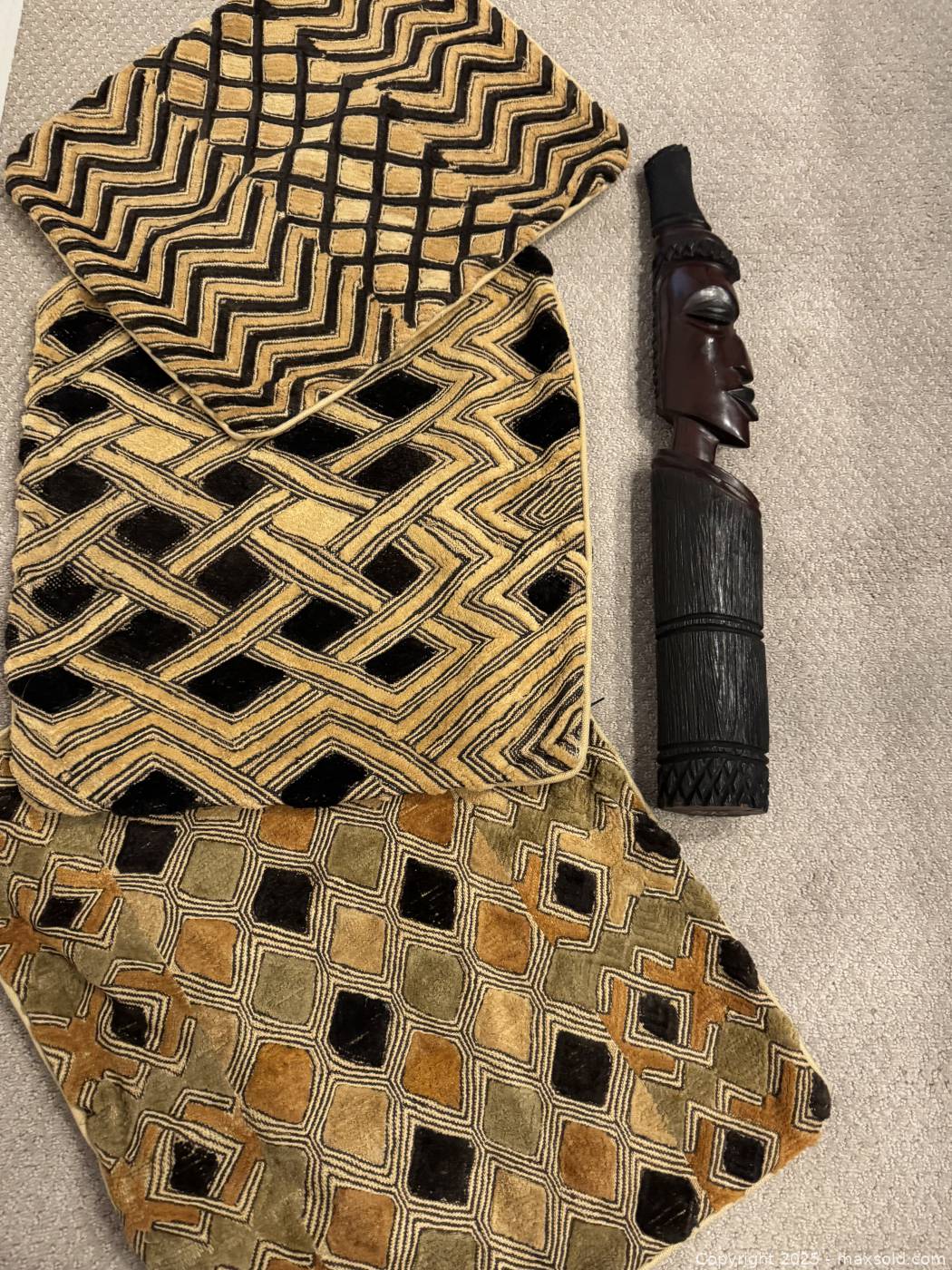 Three Kuba raffia cushion covers and carved wood figure | Maxsold