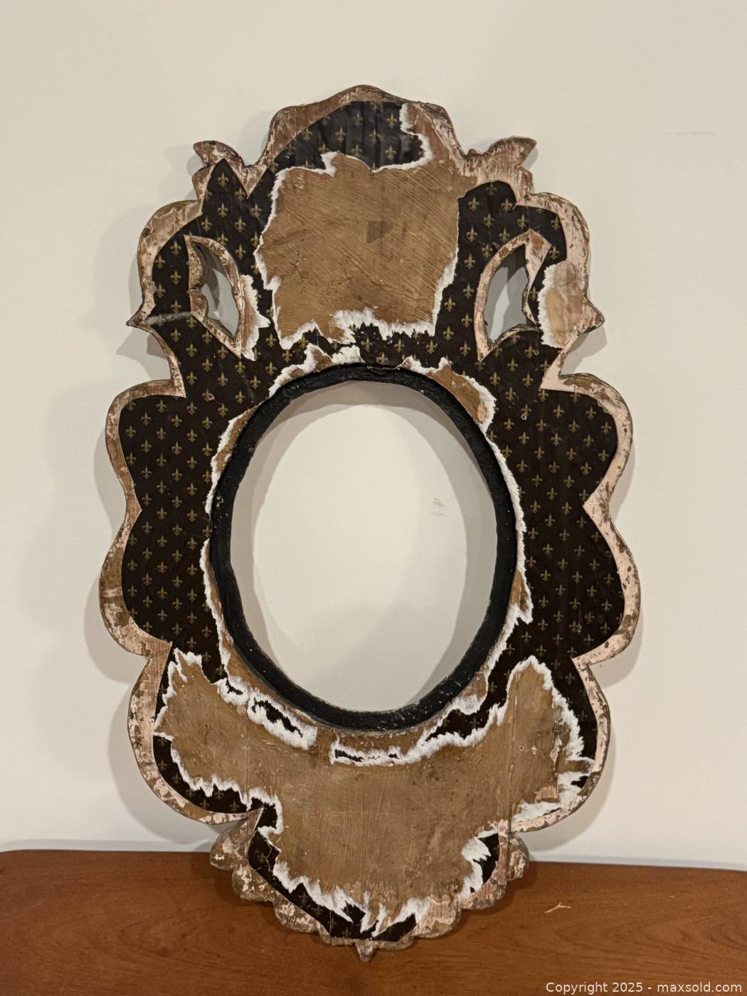 Vintage oval wooden frame and carved wood panel | Maxsold