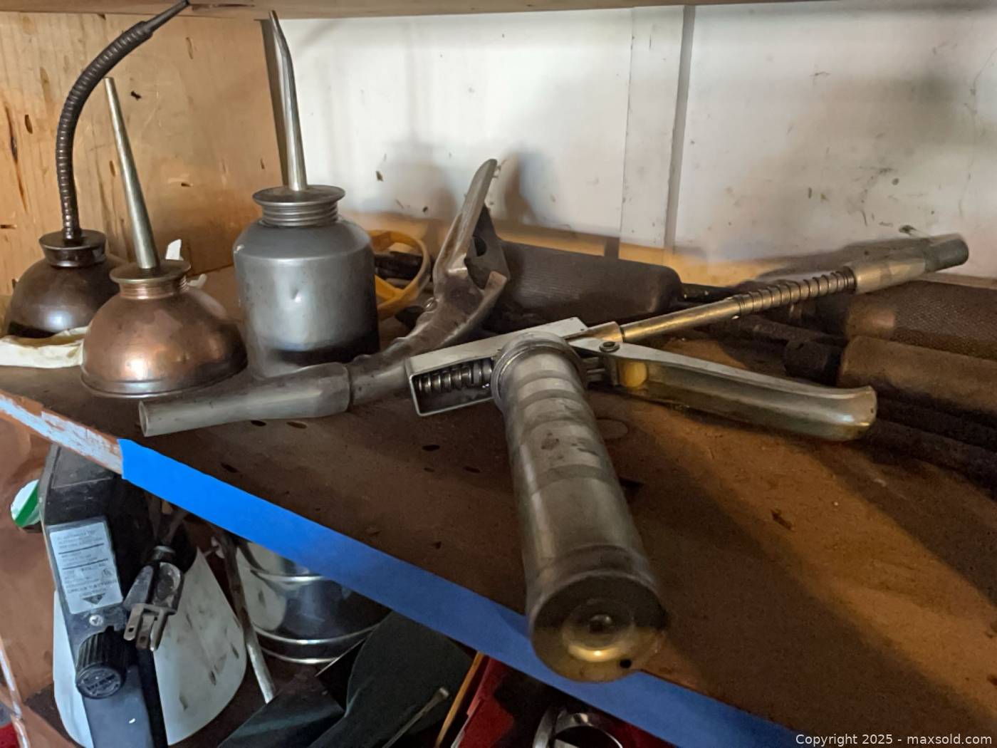 Vintage metal oil cans, funnels and grease gun | Maxsold