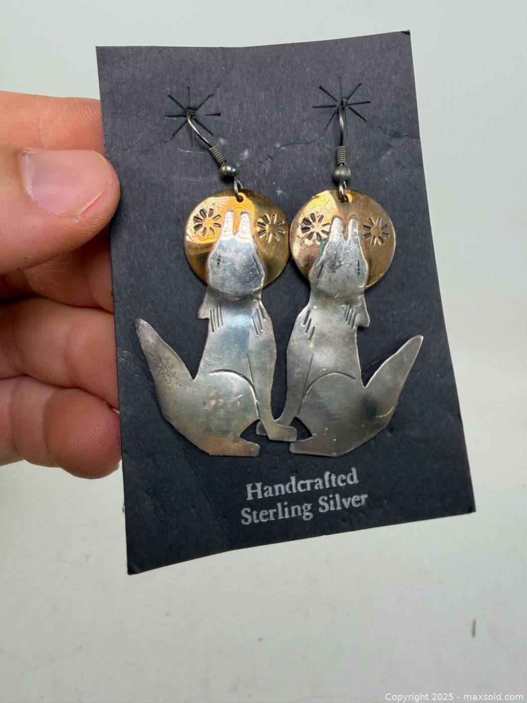 Handcrafted sterling silver wolf earrings | Maxsold