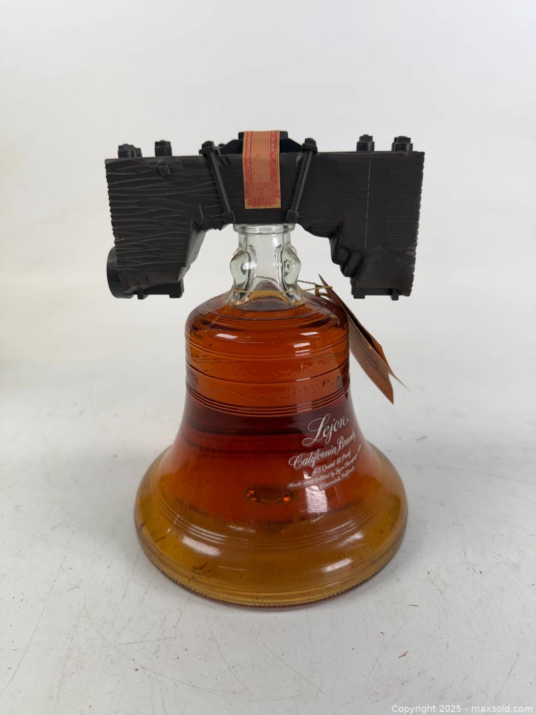 Lejon Liberty Bell Glass Brandy Bottle | Maxsold