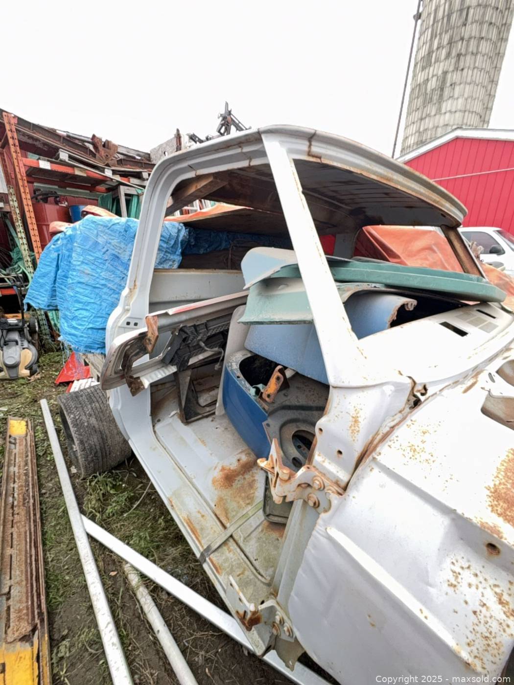 Stripped pickup truck body, door, propane tank, scrap metal | Maxsold