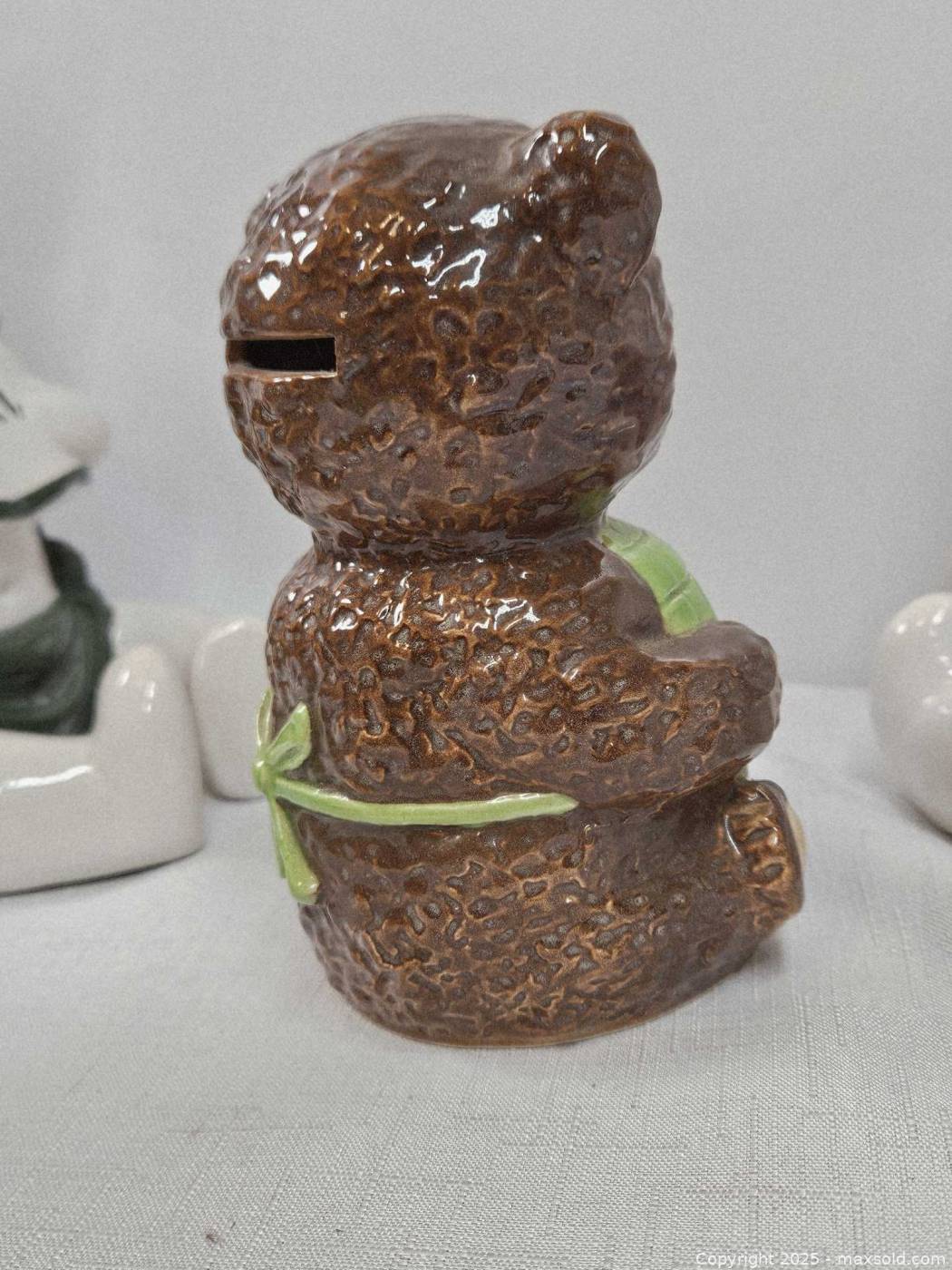 Goebel bear, Italian girl, train banks, Napco March angel | Maxsold