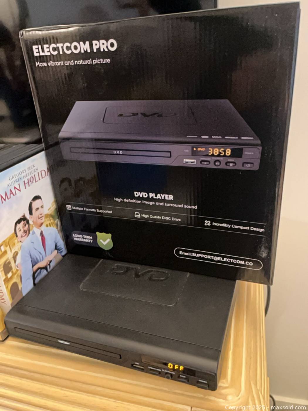 Electcom Pro DVD player with remote and 15 DVDs | Maxsold